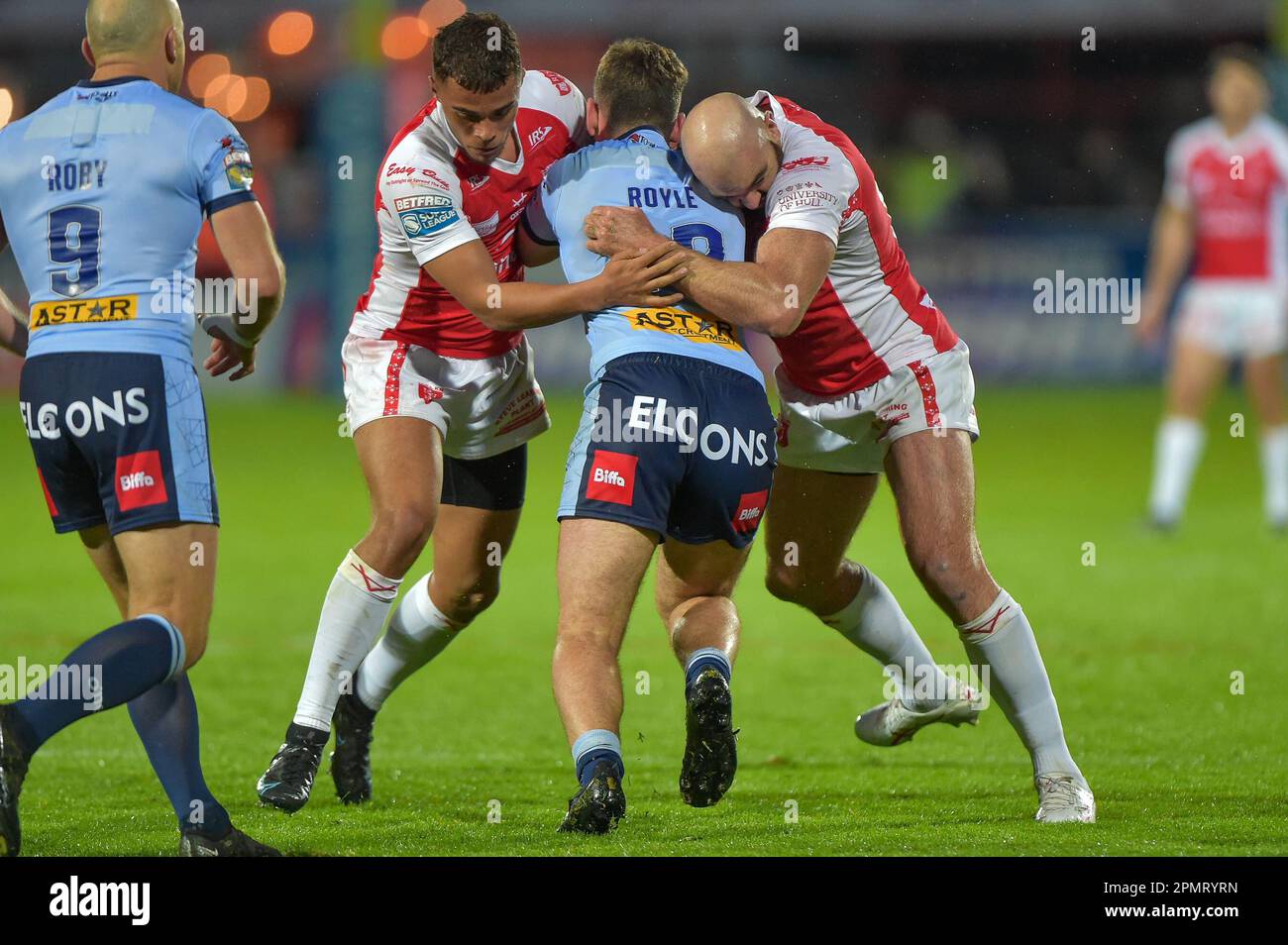 Sam Royal #22 of St Helens tackled by Kane Linnett #12 of Hull KR and ...
