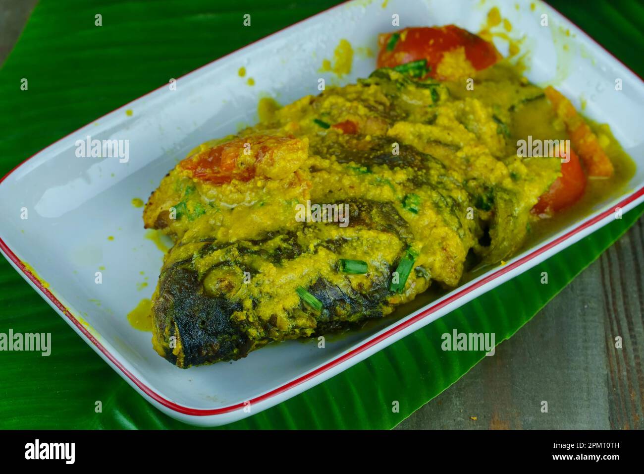 Pesmol ikan or Acar ikan kuning is a fish dish of gourami, mackerel ...