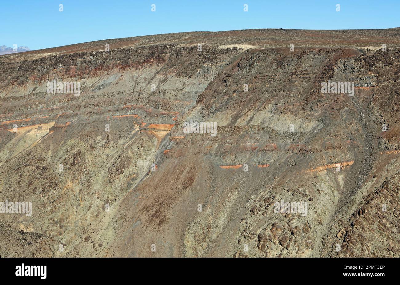 The cliff with the Rainbow in rock - Death Valley, California Stock ...