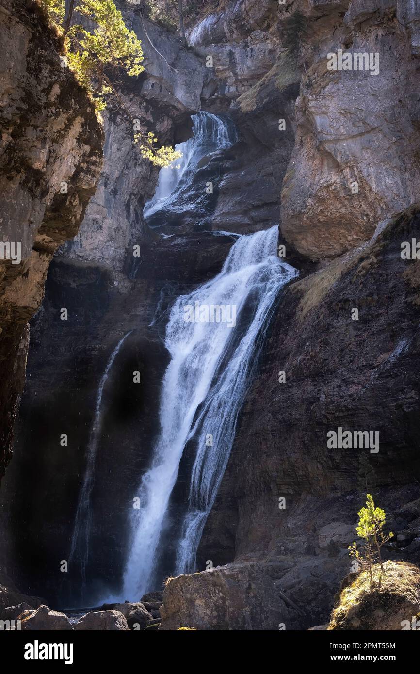 The cave waterfall in the heart of the National Park of Ordesa and ...