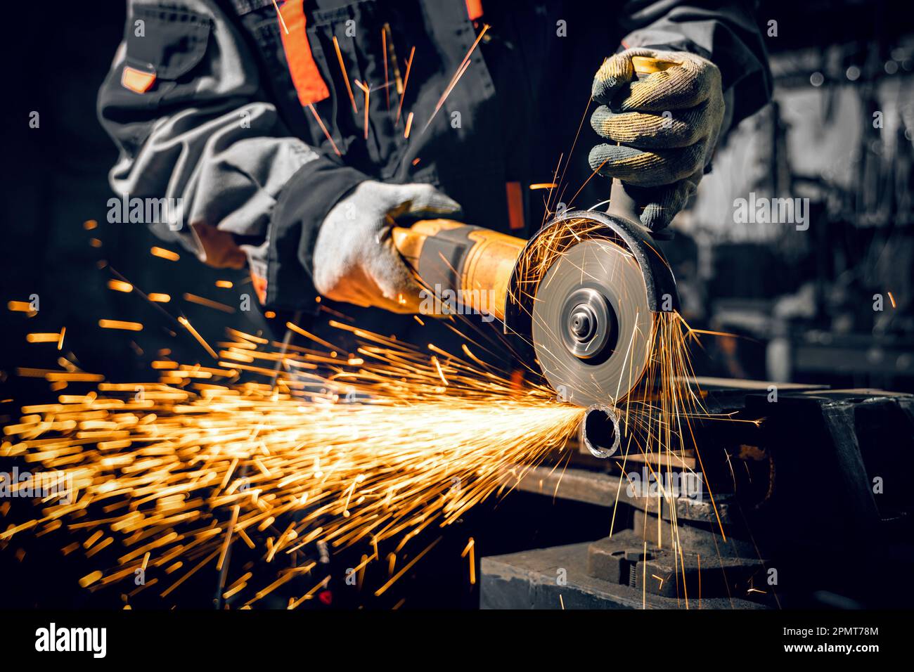Angle grinder at work, sparks and dust from the cut-off stone Stock ...