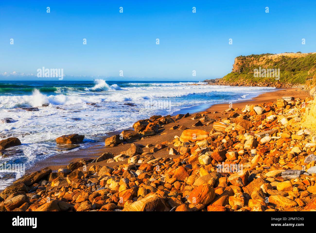 Scenic sandy rocy quarry beach in Caves beach town on Pacific coast of ...