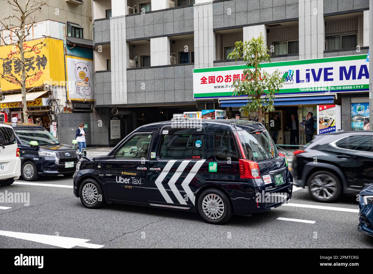 Shinjuku Tokyo April 2023, Toyota JPN black hybrid electric taxi cab ...