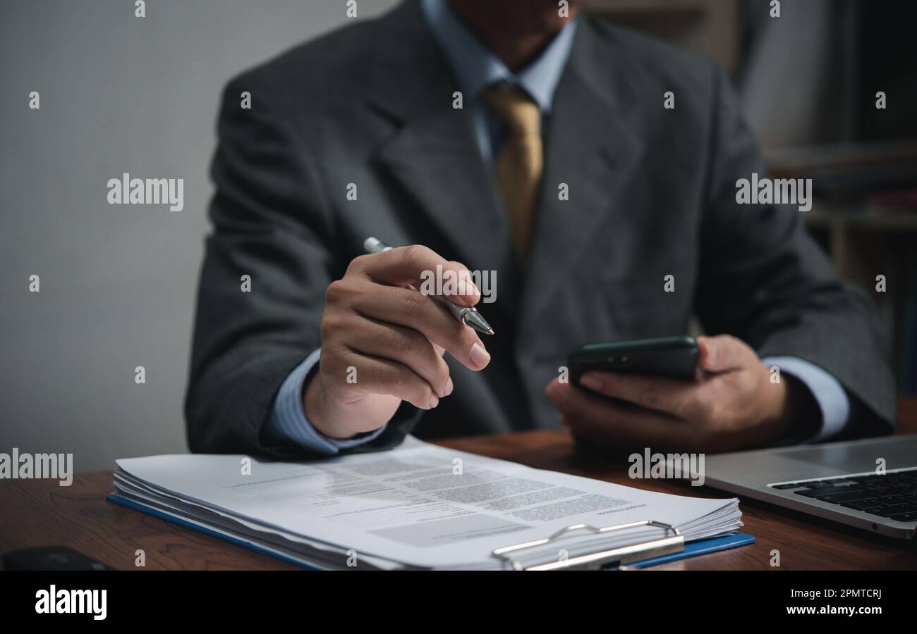Businessman signs contract investment professional documents with a pen ...