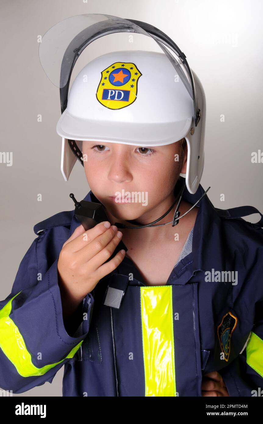 A Young boy wearing a policeman's costume Stock Photo - Alamy