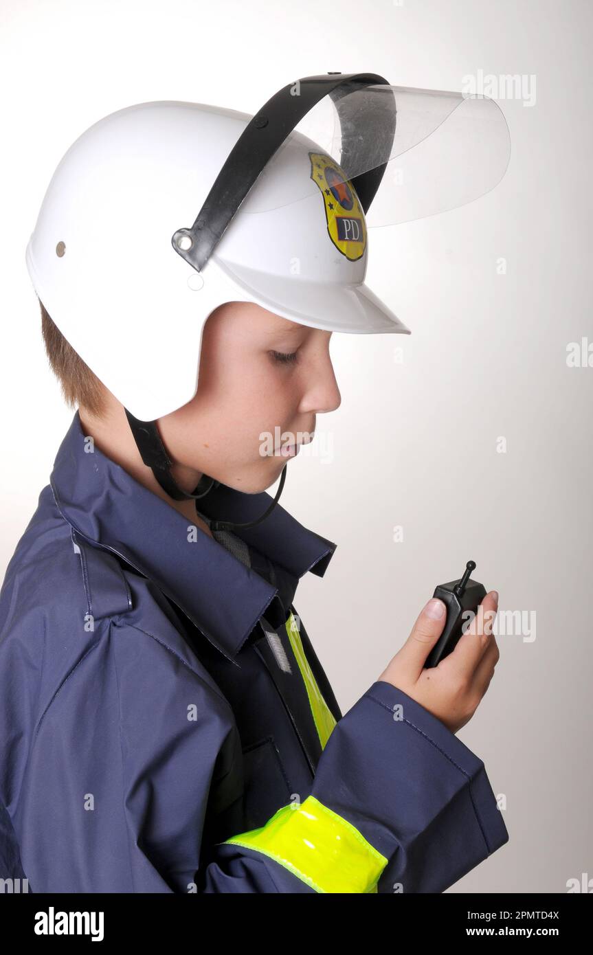 A Young boy wearing a policeman's costume Stock Photo - Alamy