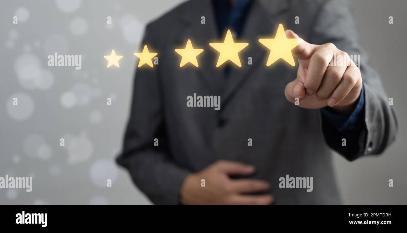business evaluation concept,Businessman pointing five star symbol ...