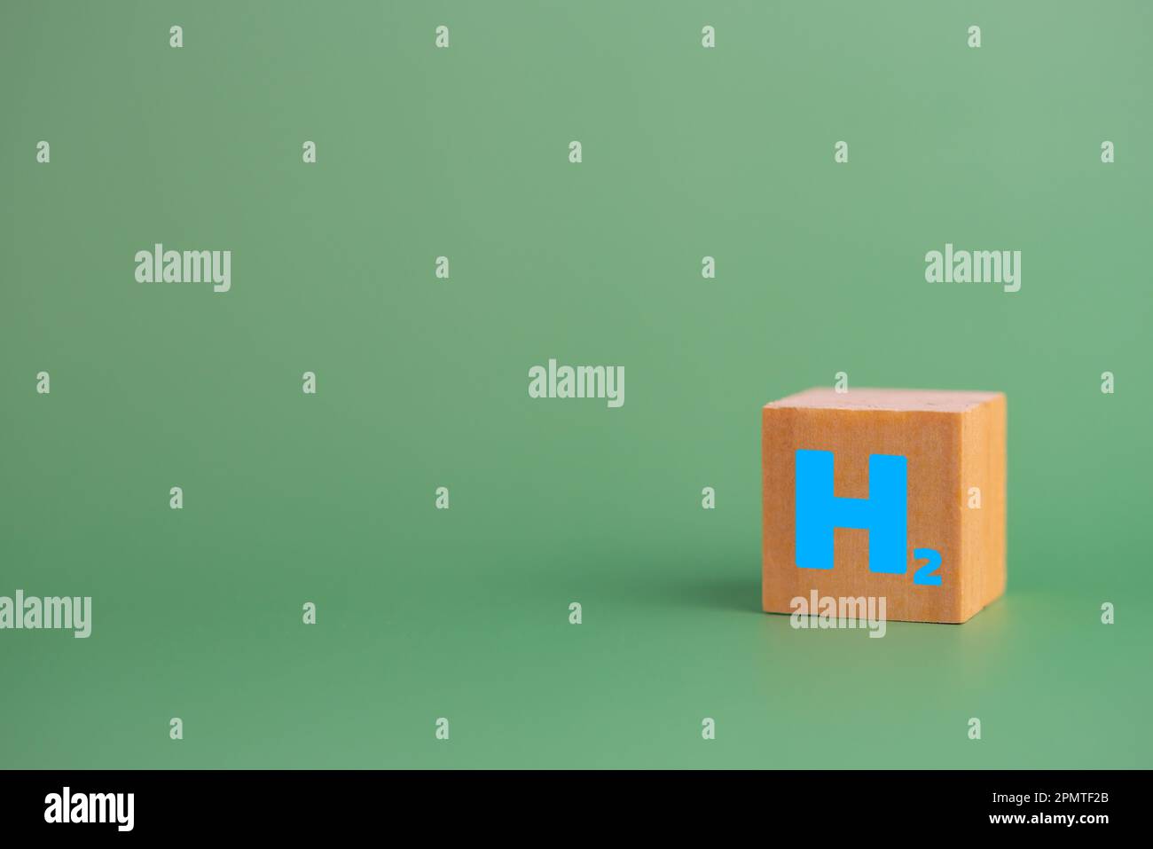 wood cube block h2 hydrogen on table Stock Photo - Alamy