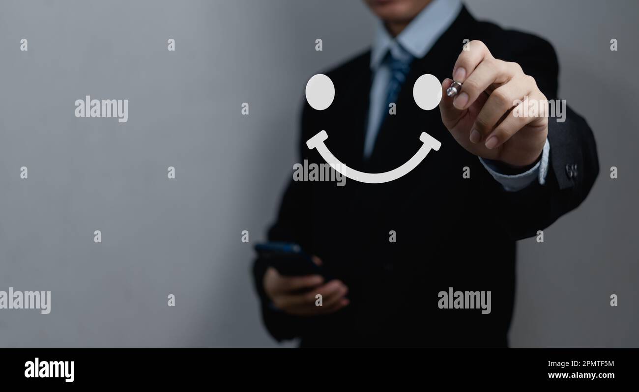 Businessman drawing a happy face smile face. Customer service ...