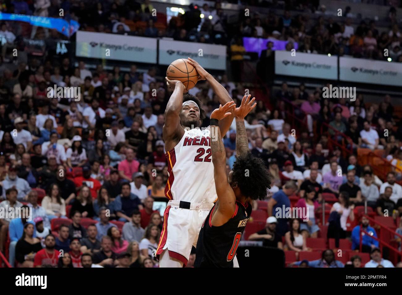 Miami Heat forward Jimmy Butler (22) shoots over Chicago Bulls guard ...