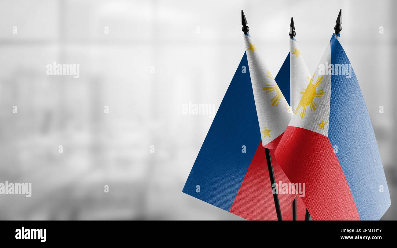 Small flags of the Philippines on an abstract blurry background Stock ...