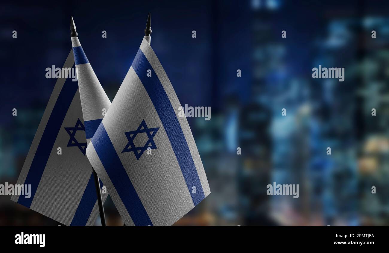 Small flags of the Israel on an abstract blurry background Stock Photo ...