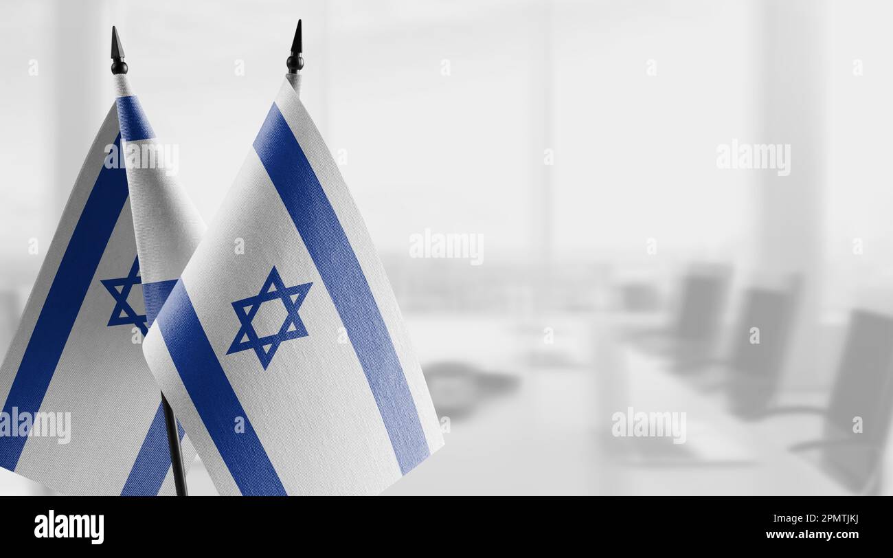 Small flags of the Israel on an abstract blurry background Stock Photo ...
