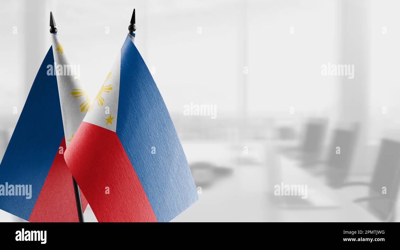 Small flags of the Philippines on an abstract blurry background Stock ...