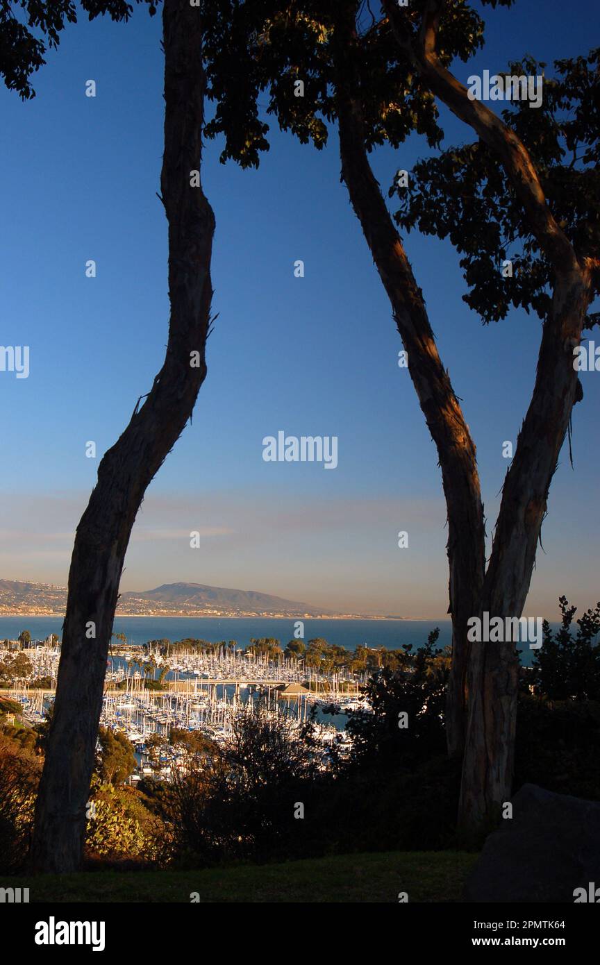 A hillside gives an aerial view of the harbor and marina, looking ...