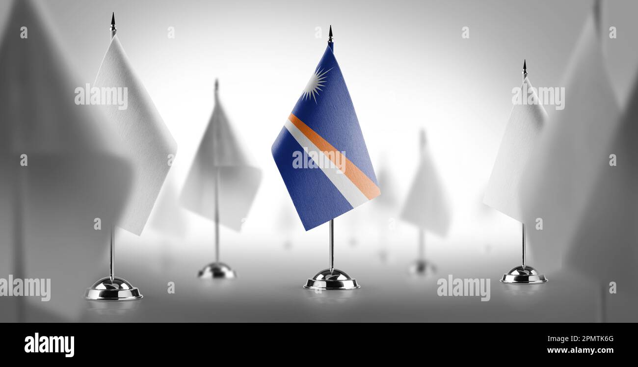 The national flag of the Marshall surrounded by white flags Stock Photo ...
