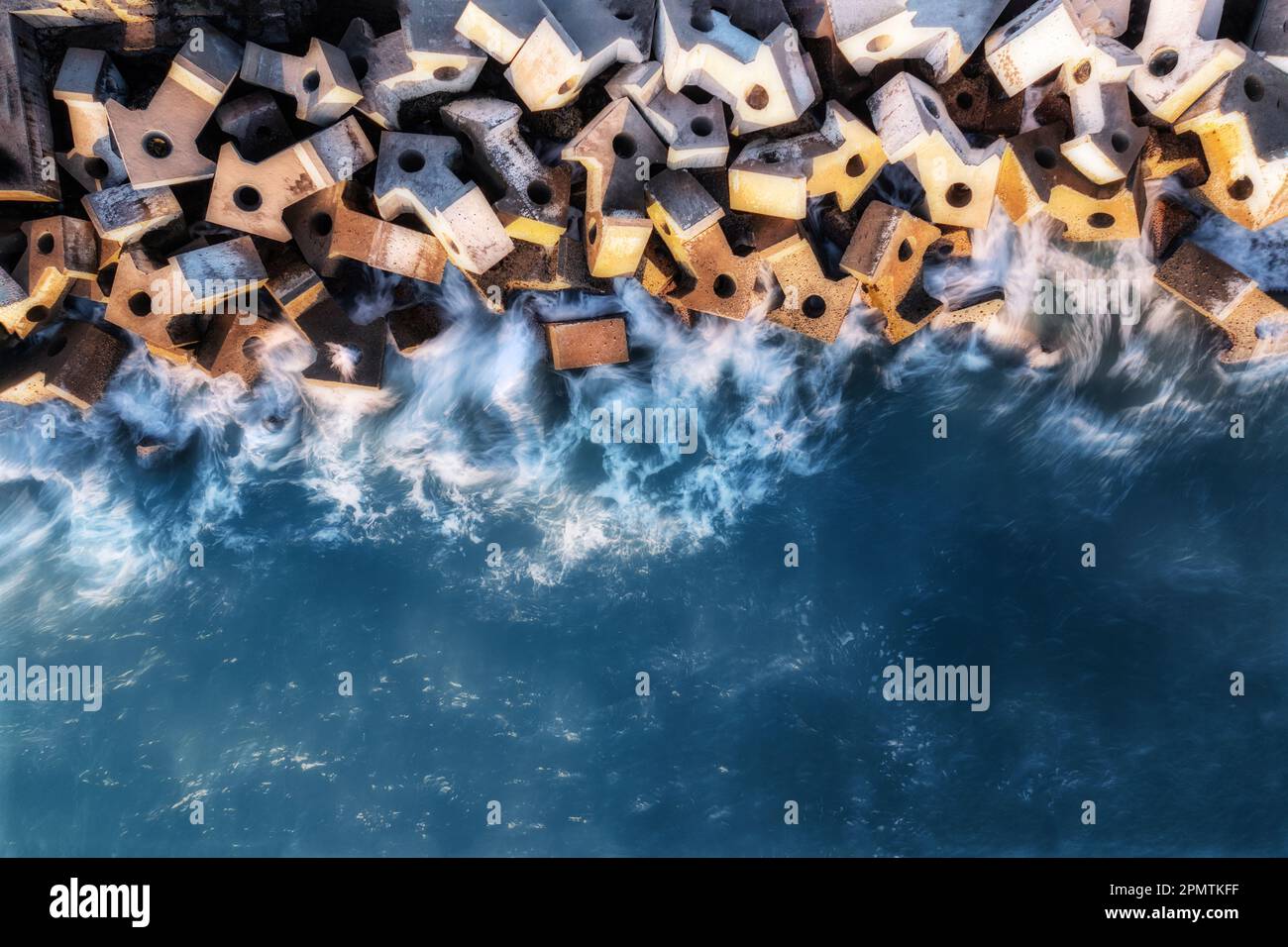 Waves crashing into beach barriers hi-res stock photography and images ...