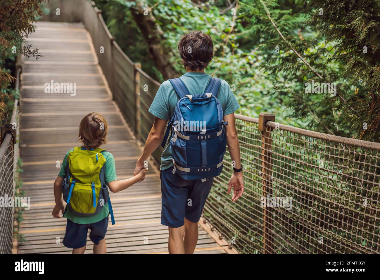 father and son tourists in Rope bridge in Yildiz Park. Besiktas ...