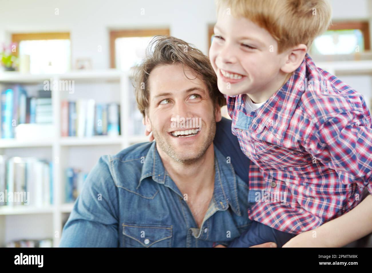 Theyre the best of chums. a young father and son spending time together at home Stock Photo - Alamy