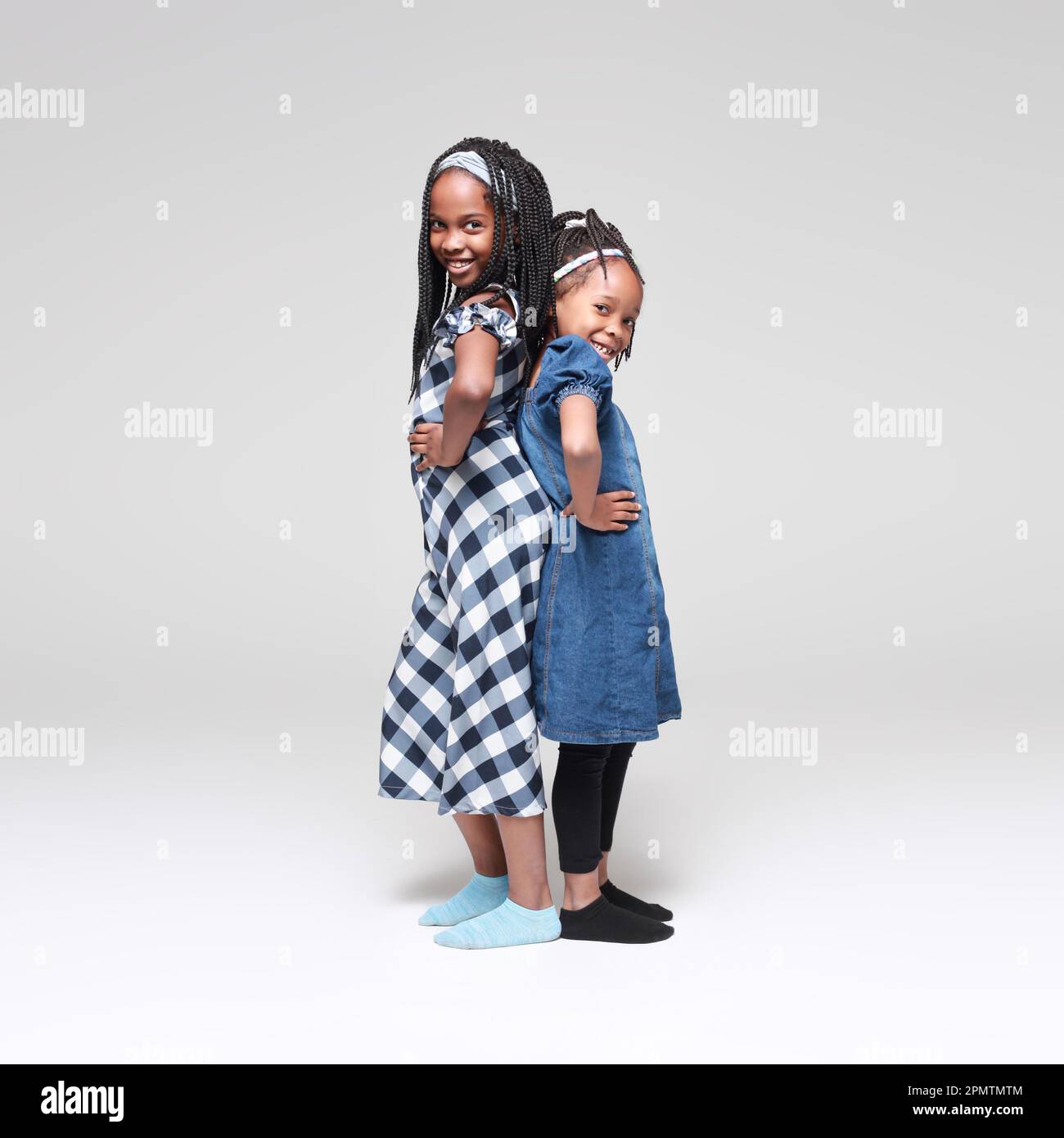 Two beautiful African-American girls with intricate braids pose ...