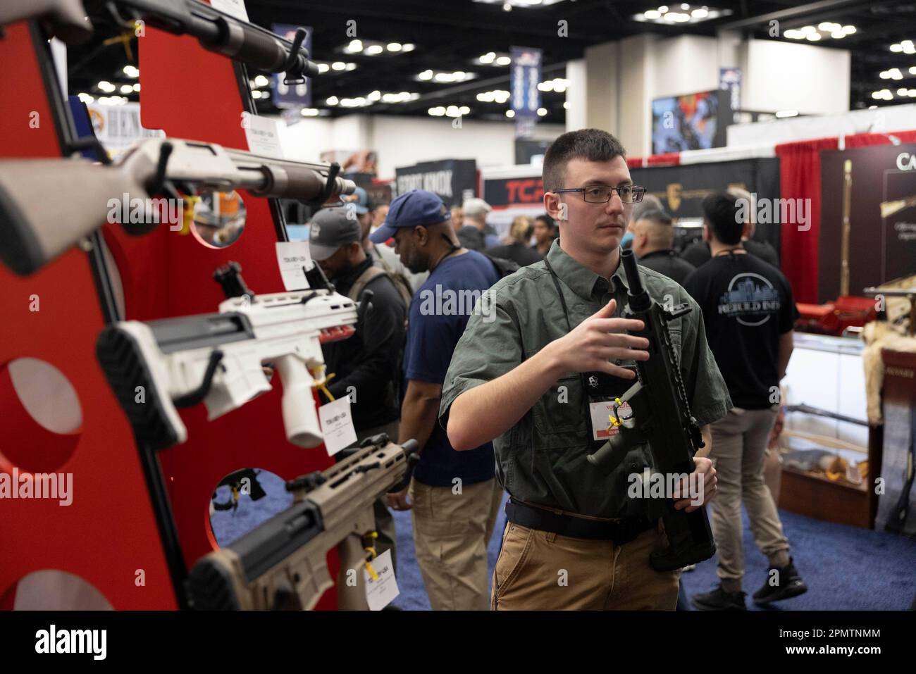 INDIANAPOLIS, INDIANA - APRIL 14: A worker shows a rifle at the Tokarev ...
