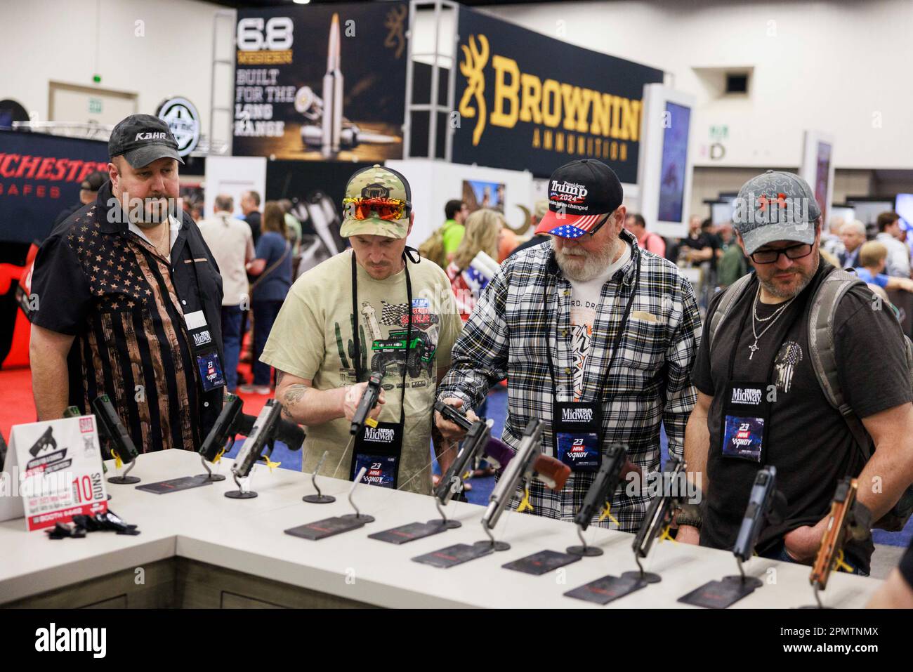 INDIANAPOLIS, INDIANA - APRIL 14: Guests check out pistols on display ...