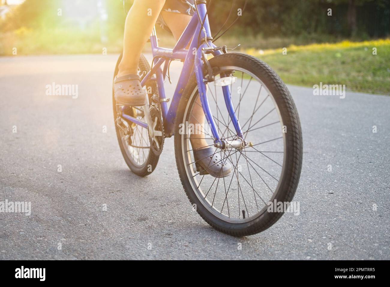 ride a bike at dawn. close-up Stock Photo - Alamy