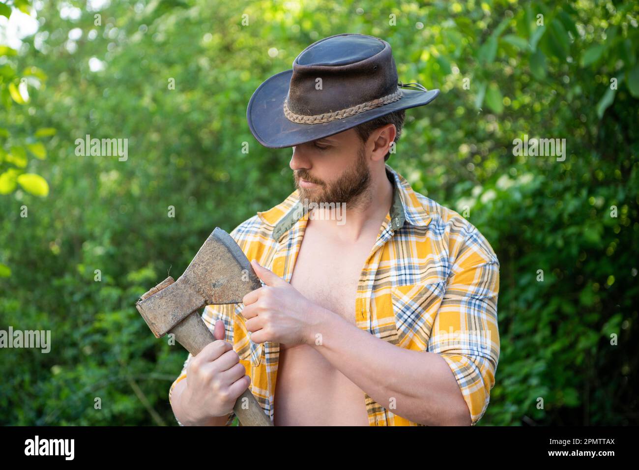 photo of rancher man with axe. rancher with axe. rancher with axe ...