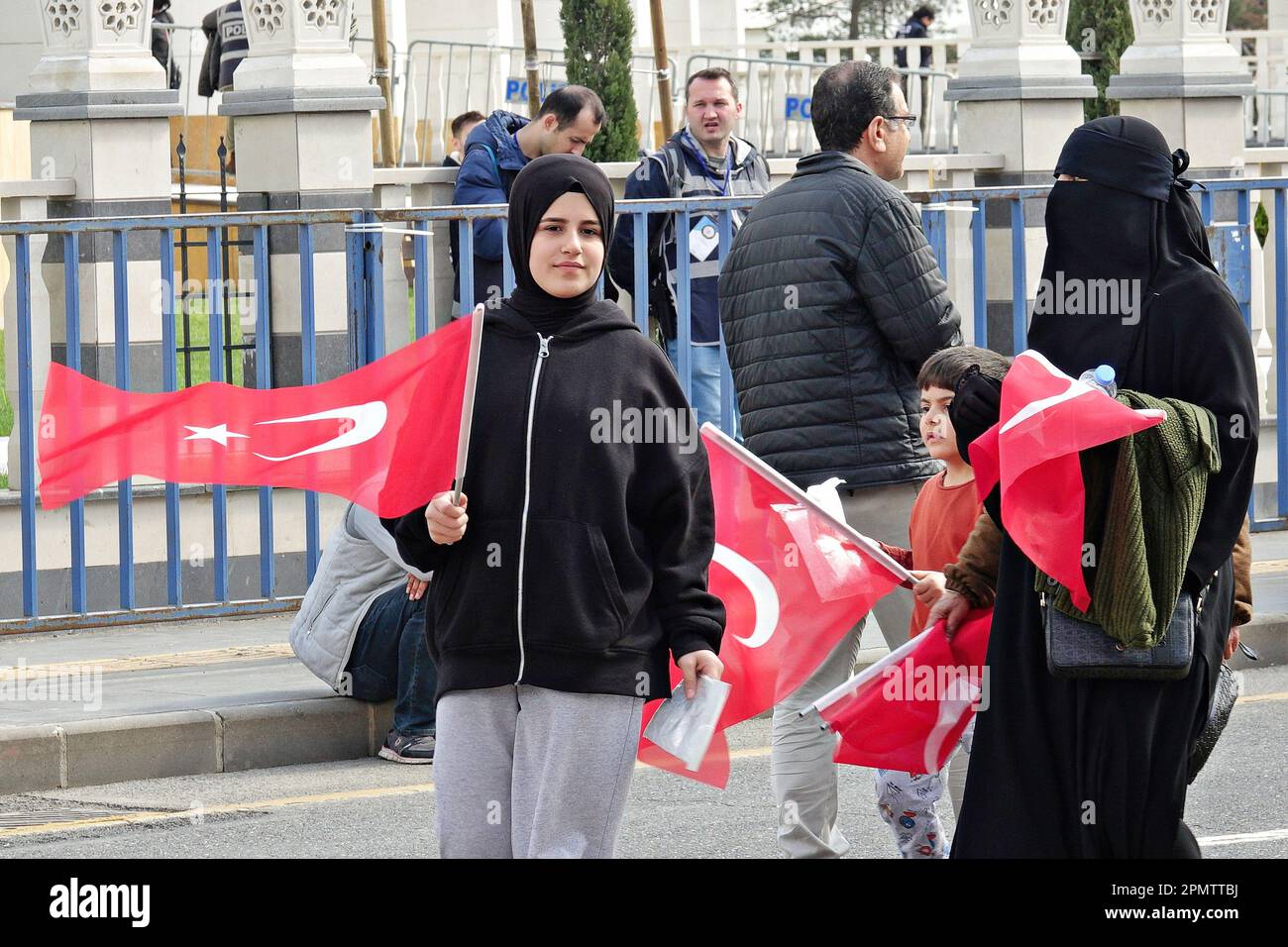 A woman attends President Recep Tayyip Erdogan's rally in a black hijab ...