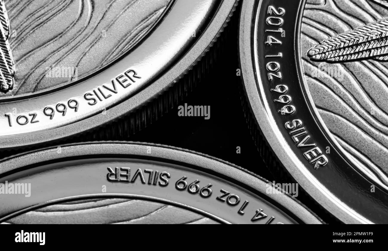 A grayscale closeup of silver coins Stock Photo - Alamy