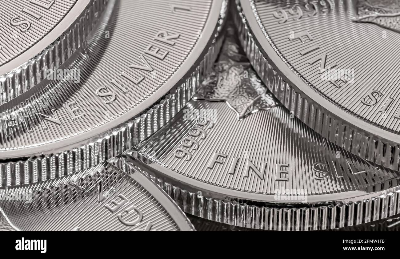 A grayscale closeup of a stack of silver coins Stock Photo - Alamy
