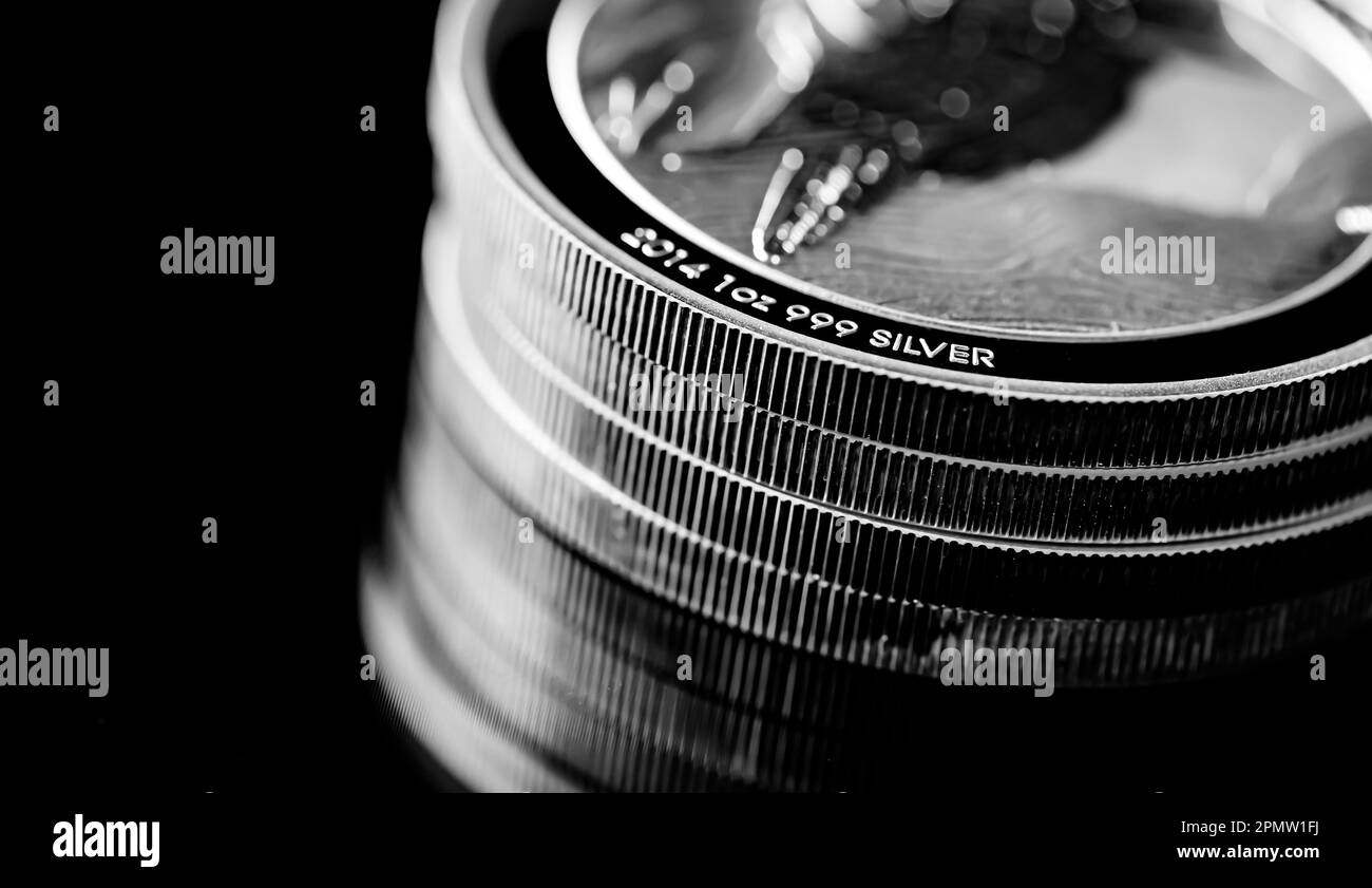 A grayscale closeup of a stack of silver coins Stock Photo - Alamy
