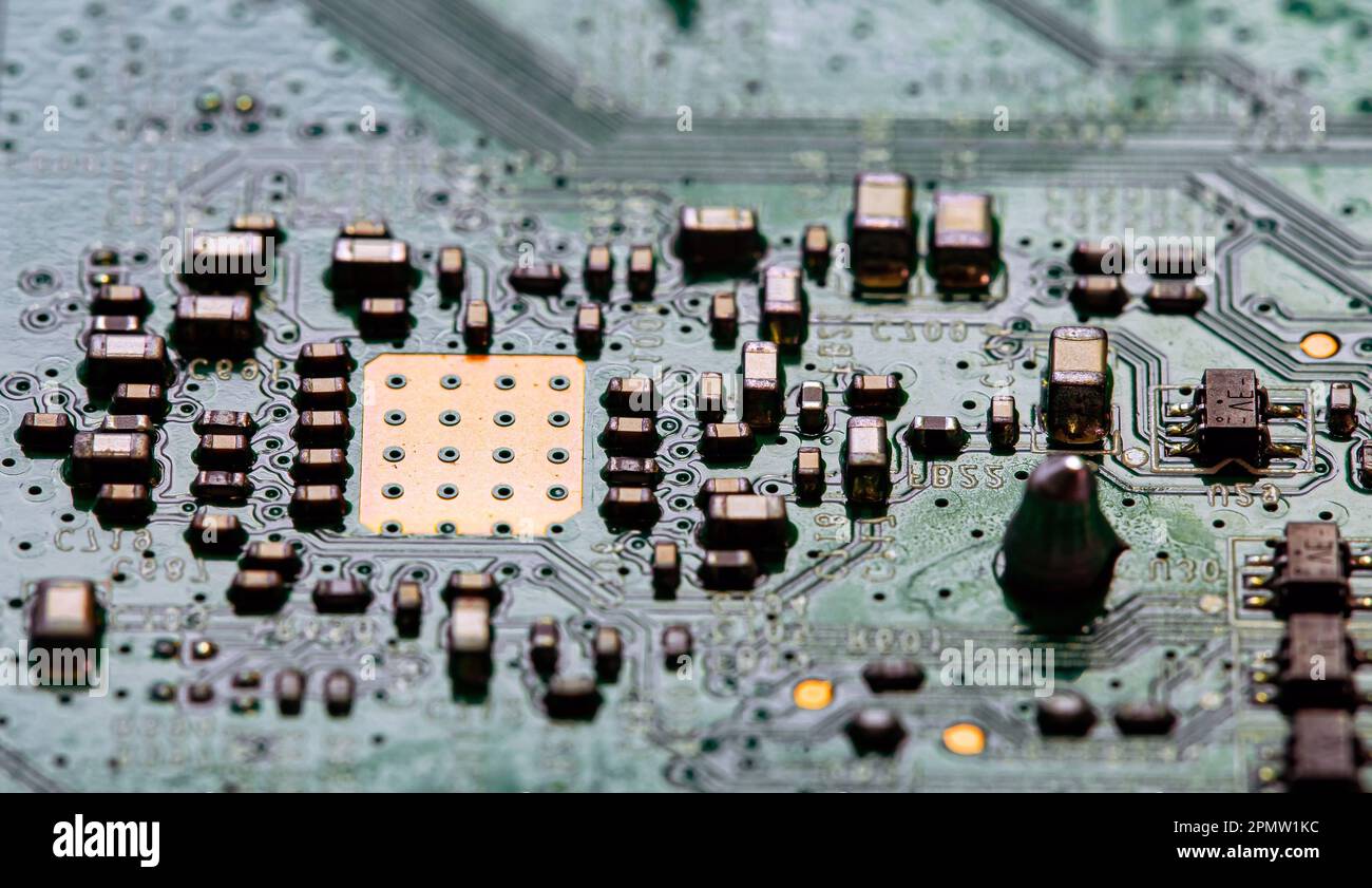 A close-up shot of an electronic circuit board with many electronic ...