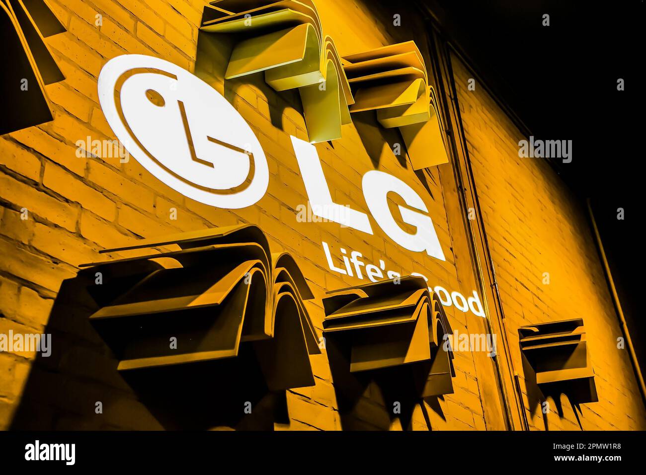 The holographic LG logo projected on a white brick building Stock Photo ...