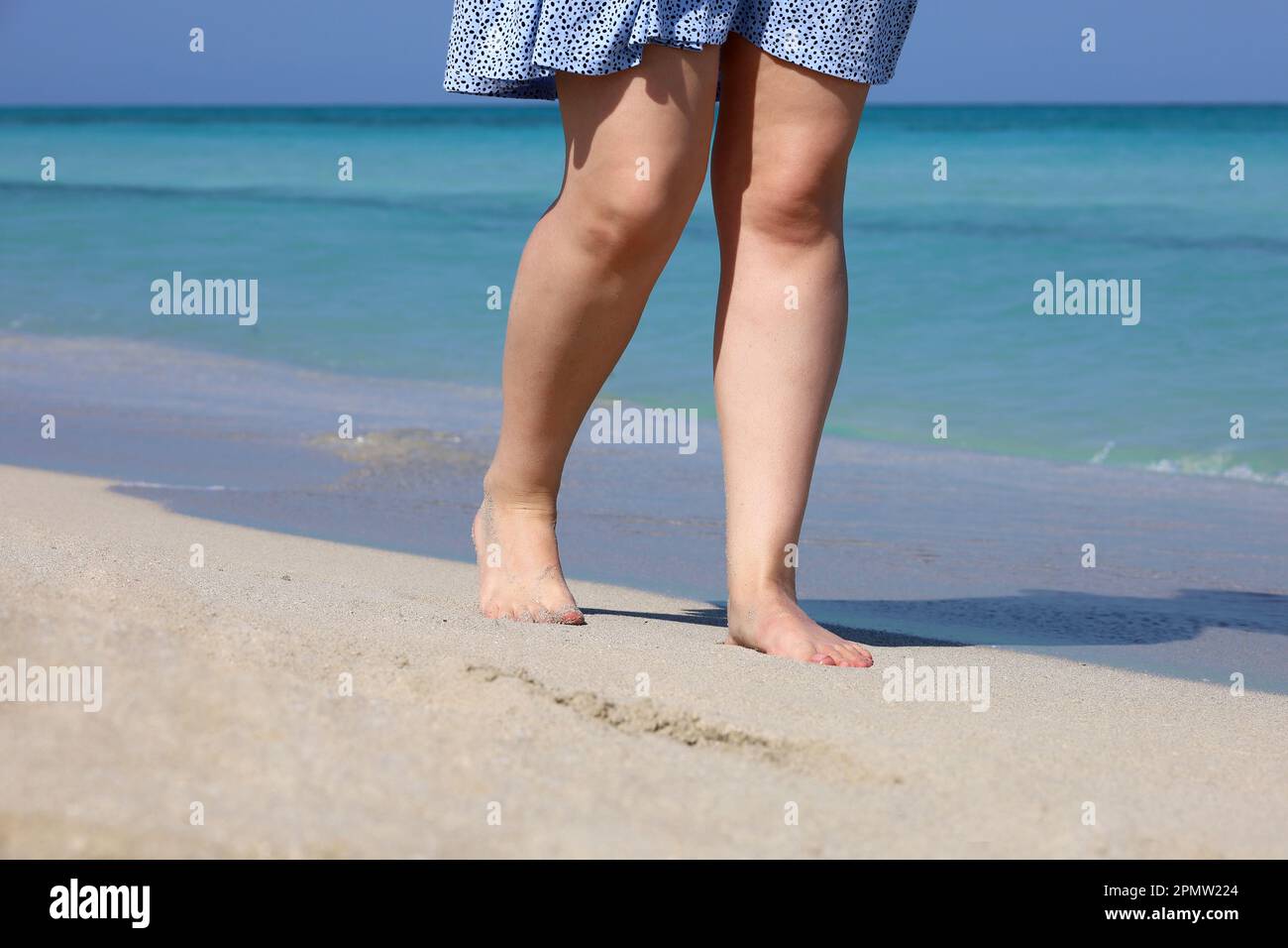 Woman barefoot on beach hi-res stock photography and images - Alamy