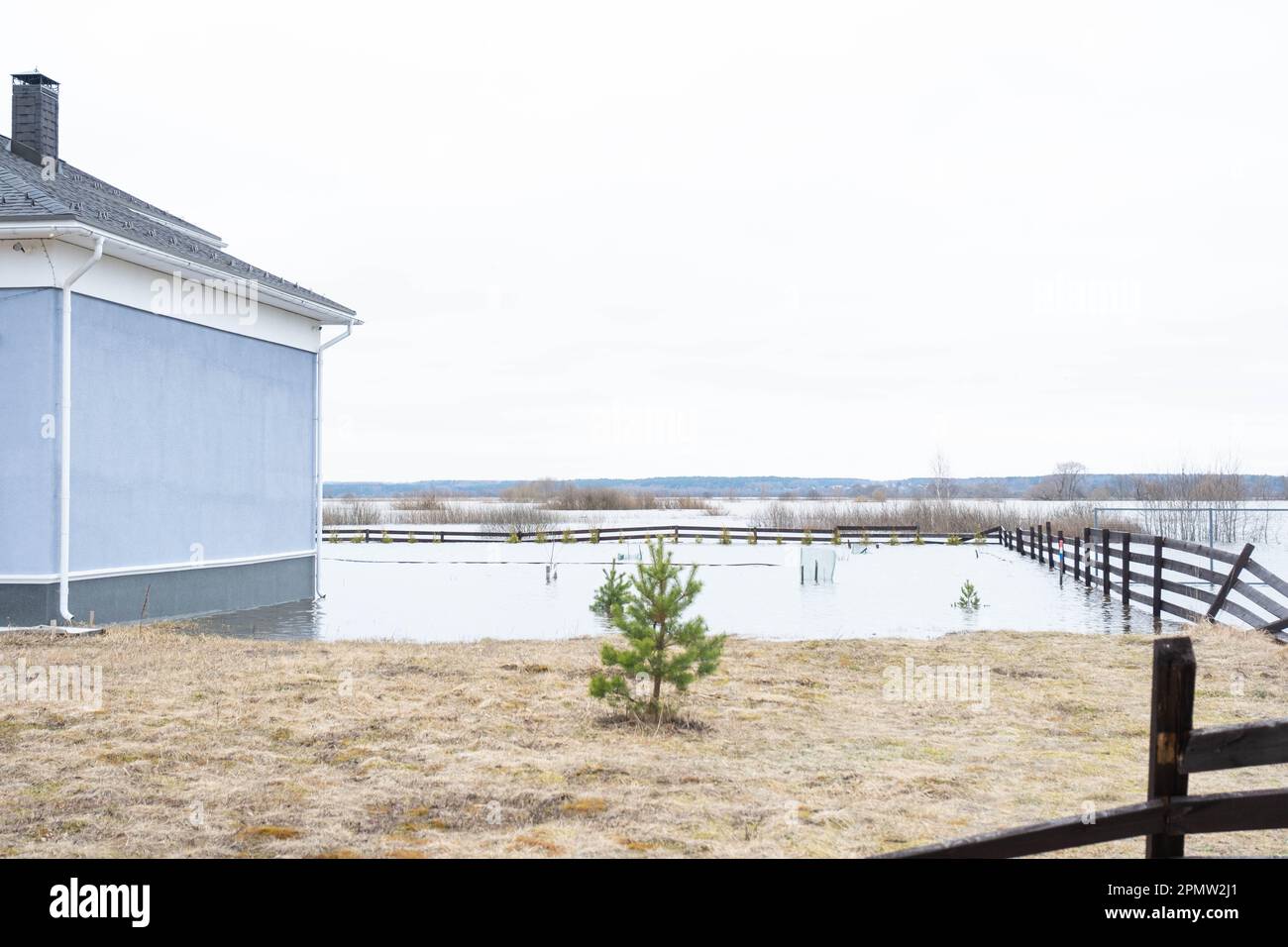 Spring flood in rural areas - flooding of the river, flooding of house ...
