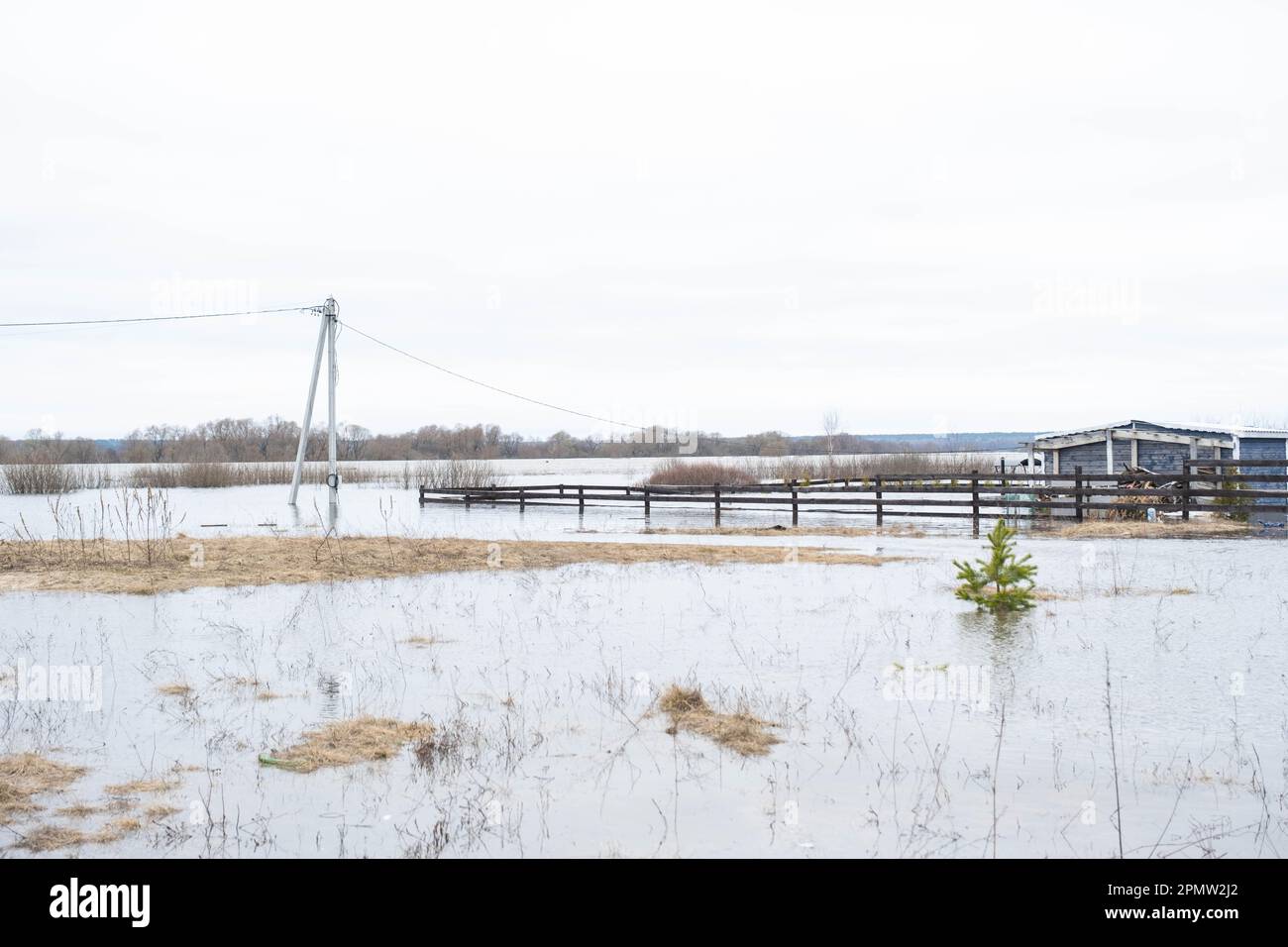 Spring flood in rural areas - flooding of the river, flooding of house ...