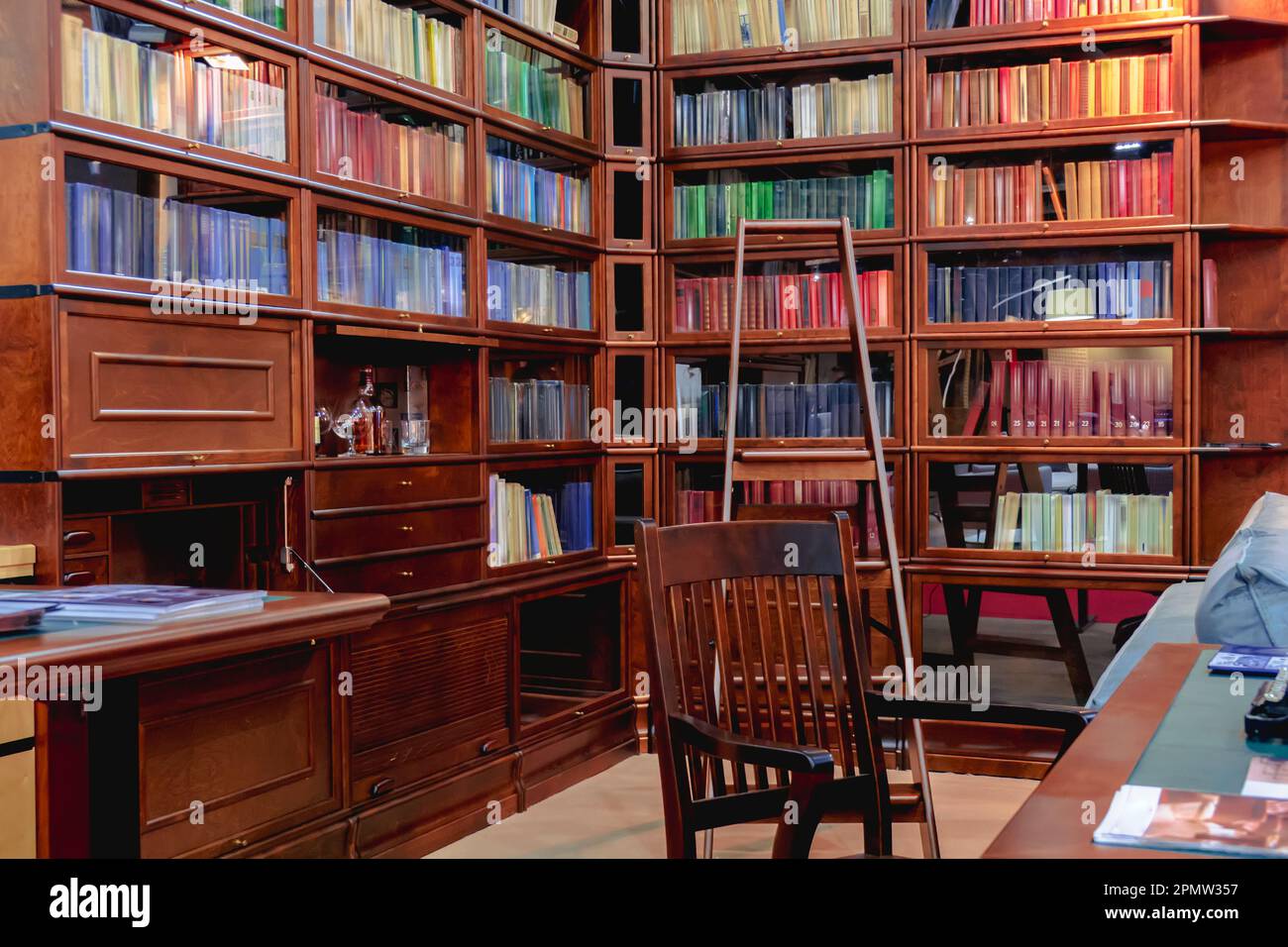 Study room with bookcases in brown style Stock Photo - Alamy