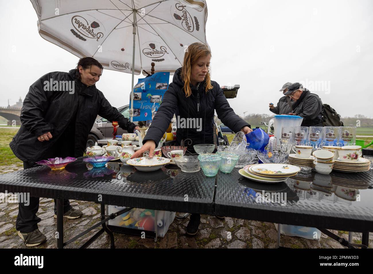 Dresden, Germany. 15th Apr, 2023. Two stand operators set up their ...