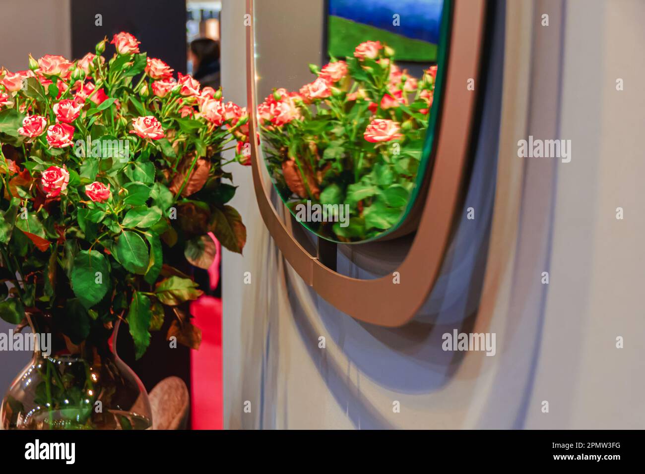 Bouquet of red roses on a shelf by the mirror Stock Photo - Alamy