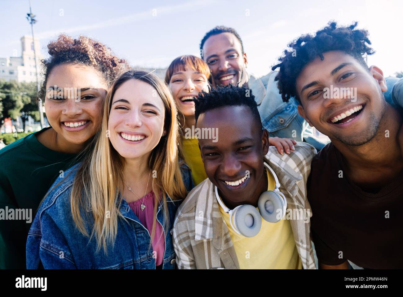 Diverse group of millennial friends laughing together outside Stock ...