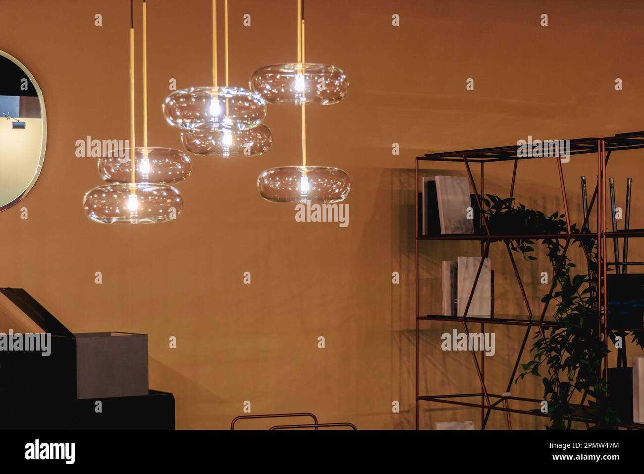 Flat glass lamps suspended from the ceiling Stock Photo - Alamy