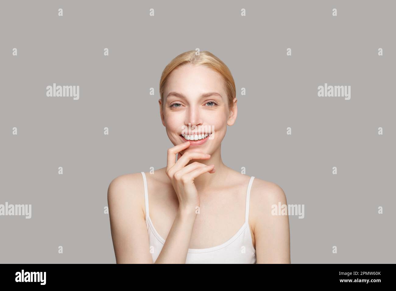 Beautiful happy woman with clear skin and cute joyful smile. Facial ...