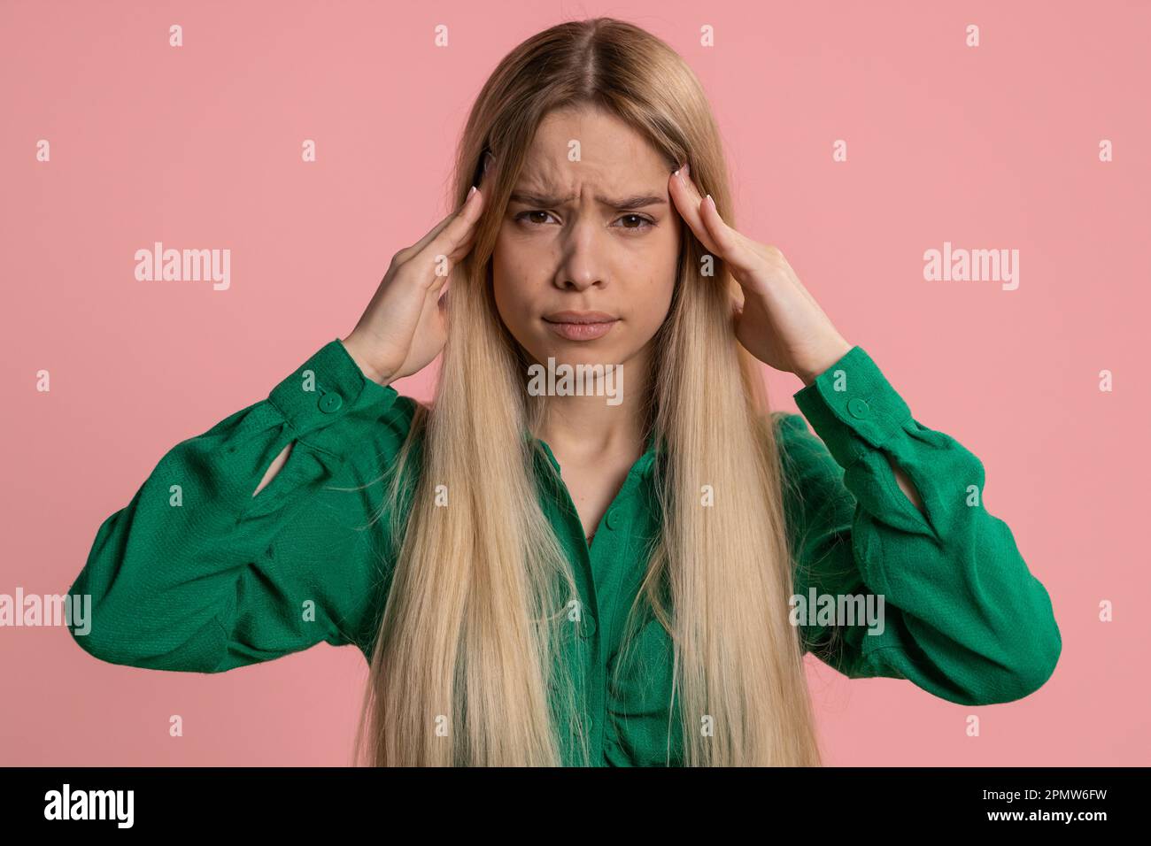 Sick ill caucasian teen young woman rubbing temples to cure headache ...