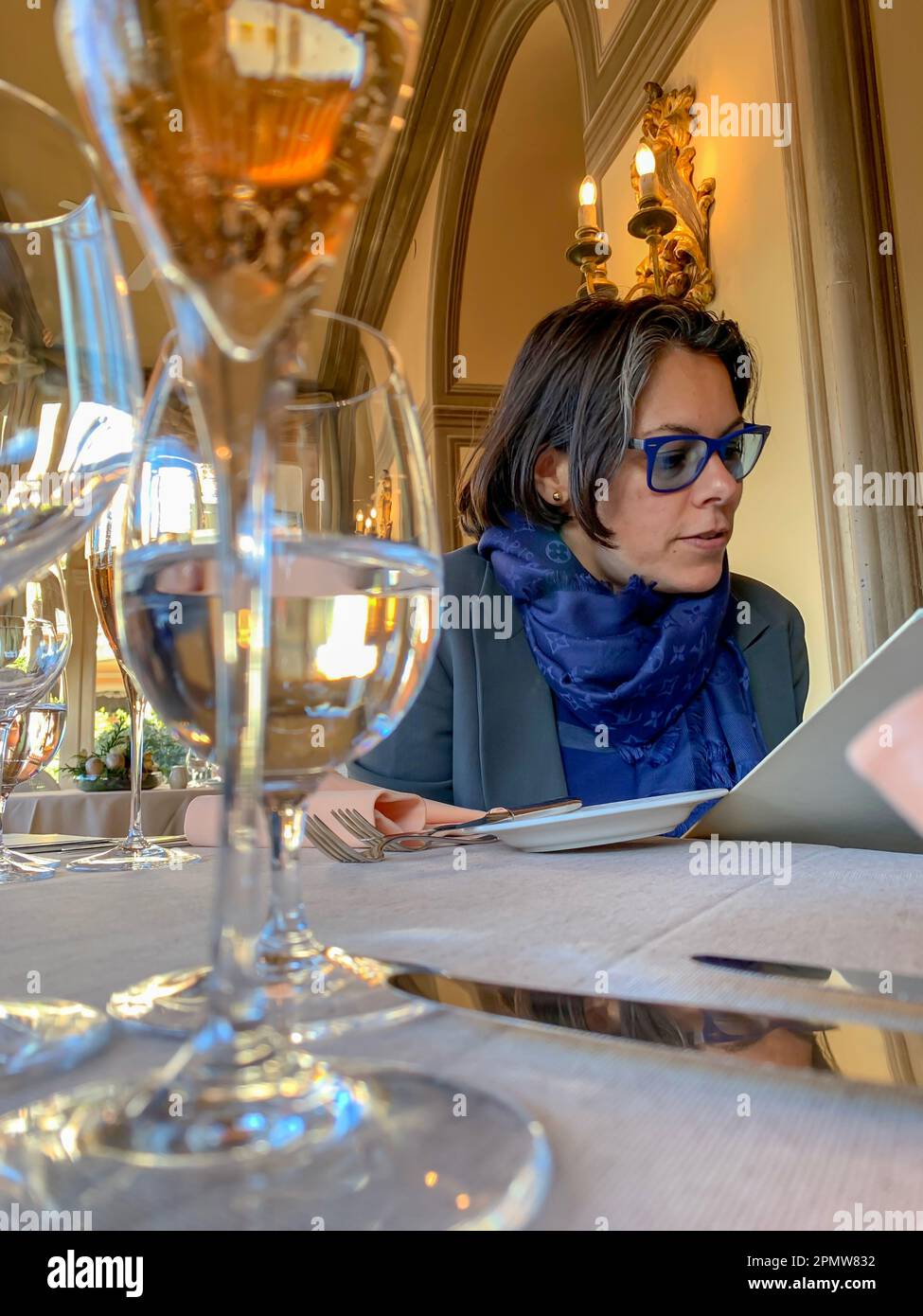 Woman Reading the Menu in Luxury Restaurant Stock Photo - Alamy