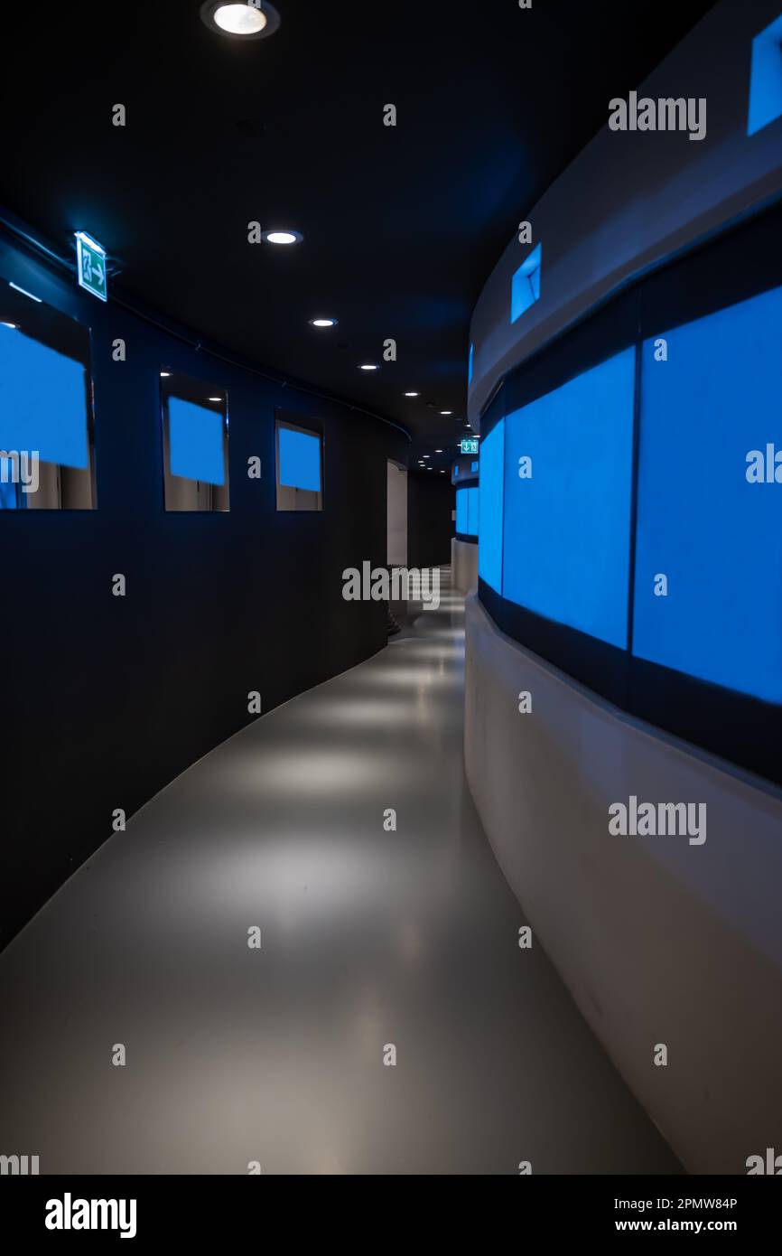 Illuminated Corridor with TV Screens in Switzerland Stock Photo - Alamy