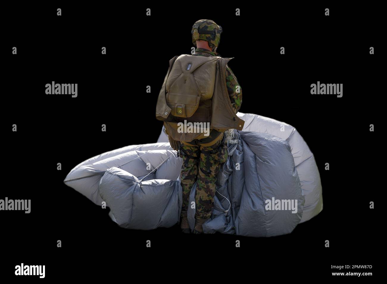 Military Parachuter Standing with His Parachute on Black Background in ...