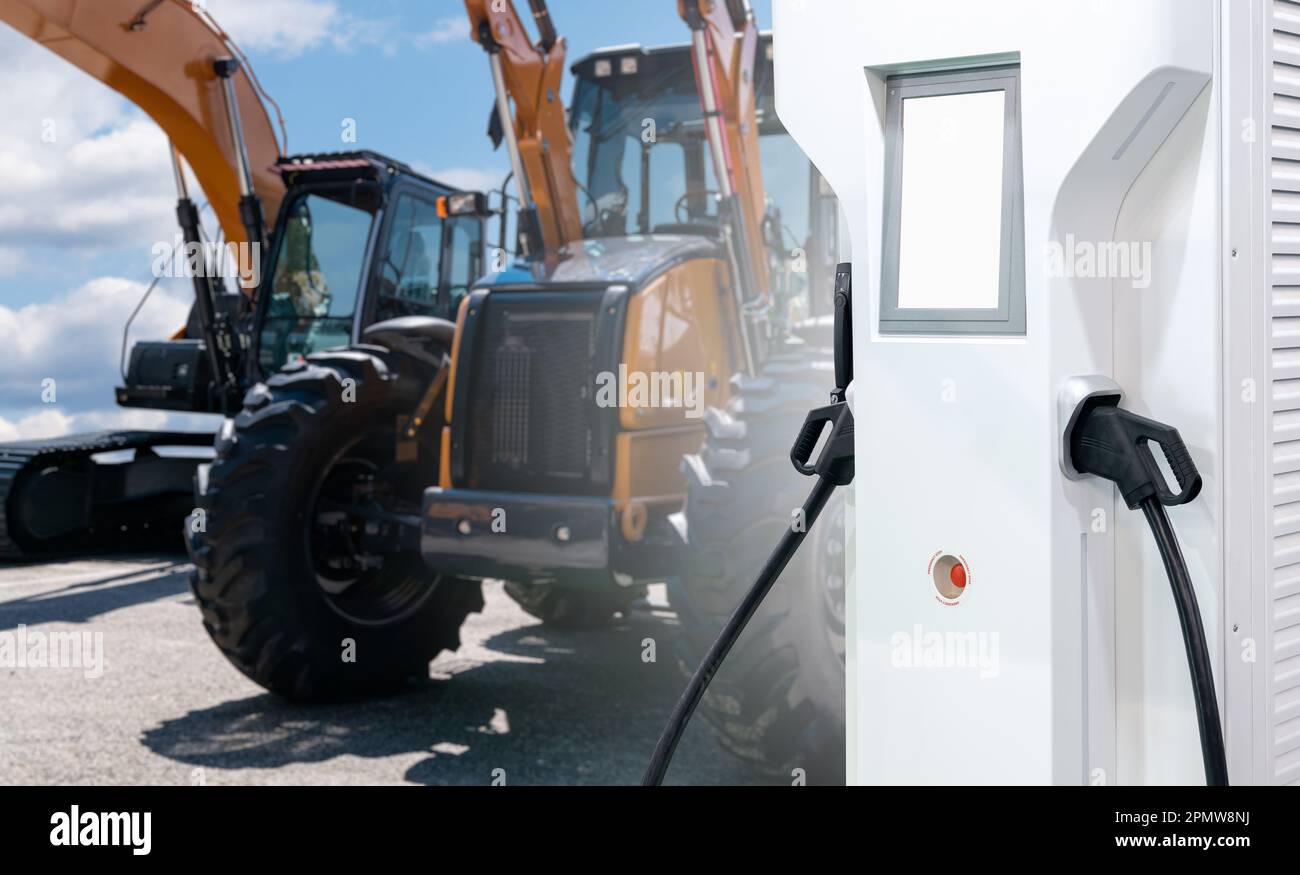 Electric construction machines with charging station. Concept. High ...