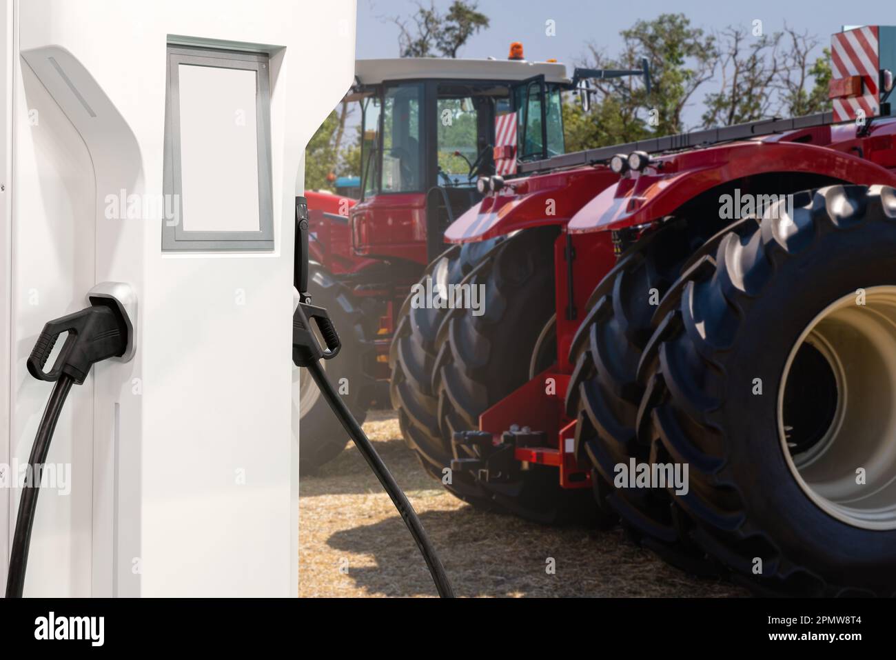 Electric vehicles charging station on a background of agricultural ...