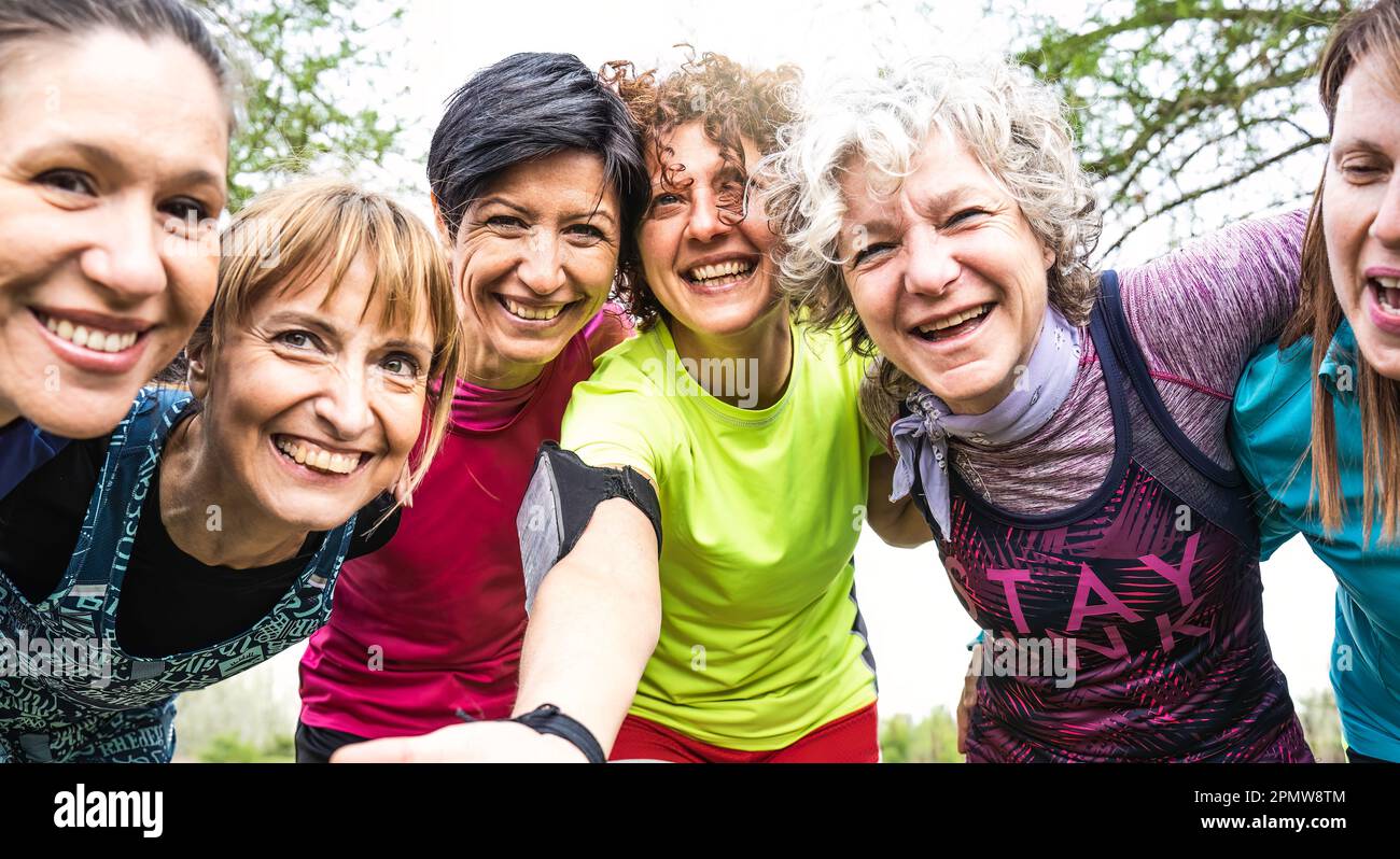 Happy multi generational women having fun together at city park ...